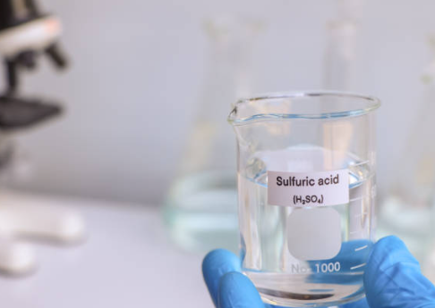 How does H2SO4 dissociate in water?